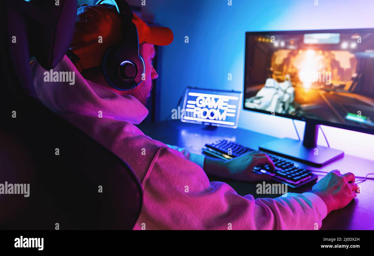 Professional Gamer Playing First-Person Shooter Online Video Game on ...