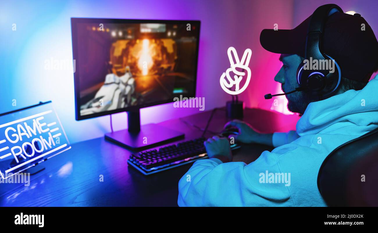 Gamer Playing First-Person Shooter Online Video Game on His Powerful ...