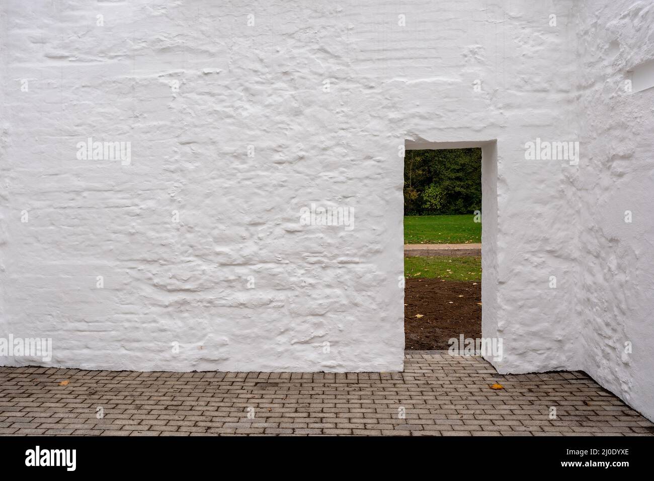 Gate on the white wall Stock Photo - Alamy