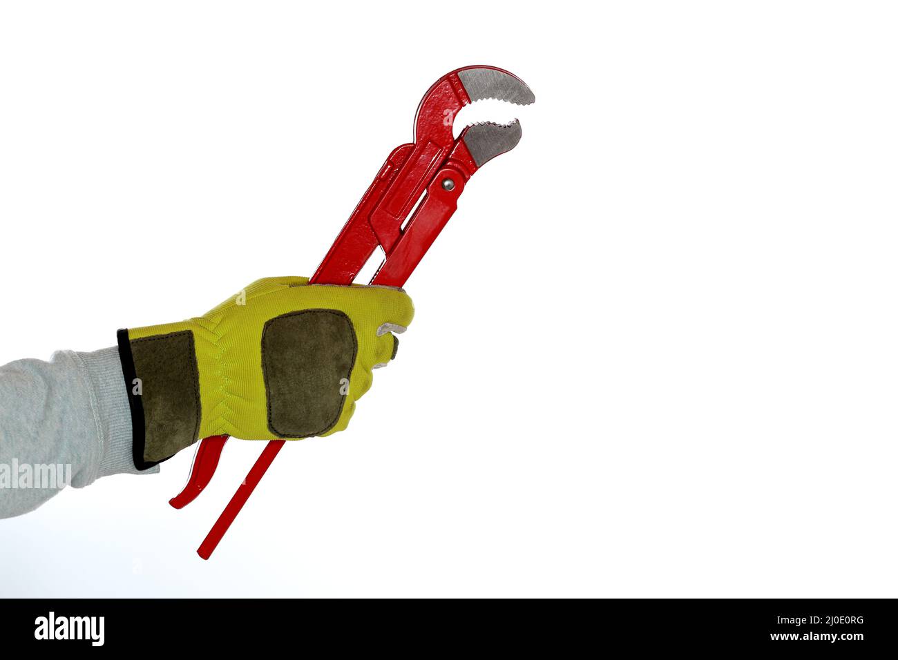 Red wrench in hand Stock Photo - Alamy