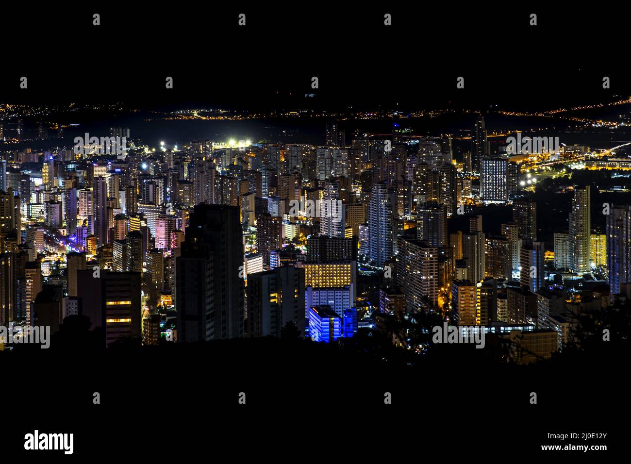 Beautiful night view of a cityscape with tall buildings Stock Photo - Alamy