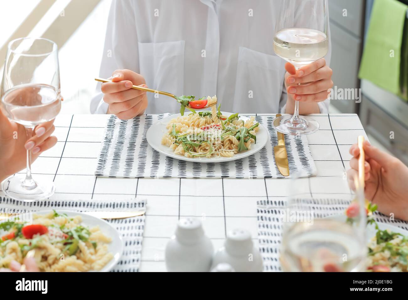 Women eating pasta hi-res stock photography and images - Alamy