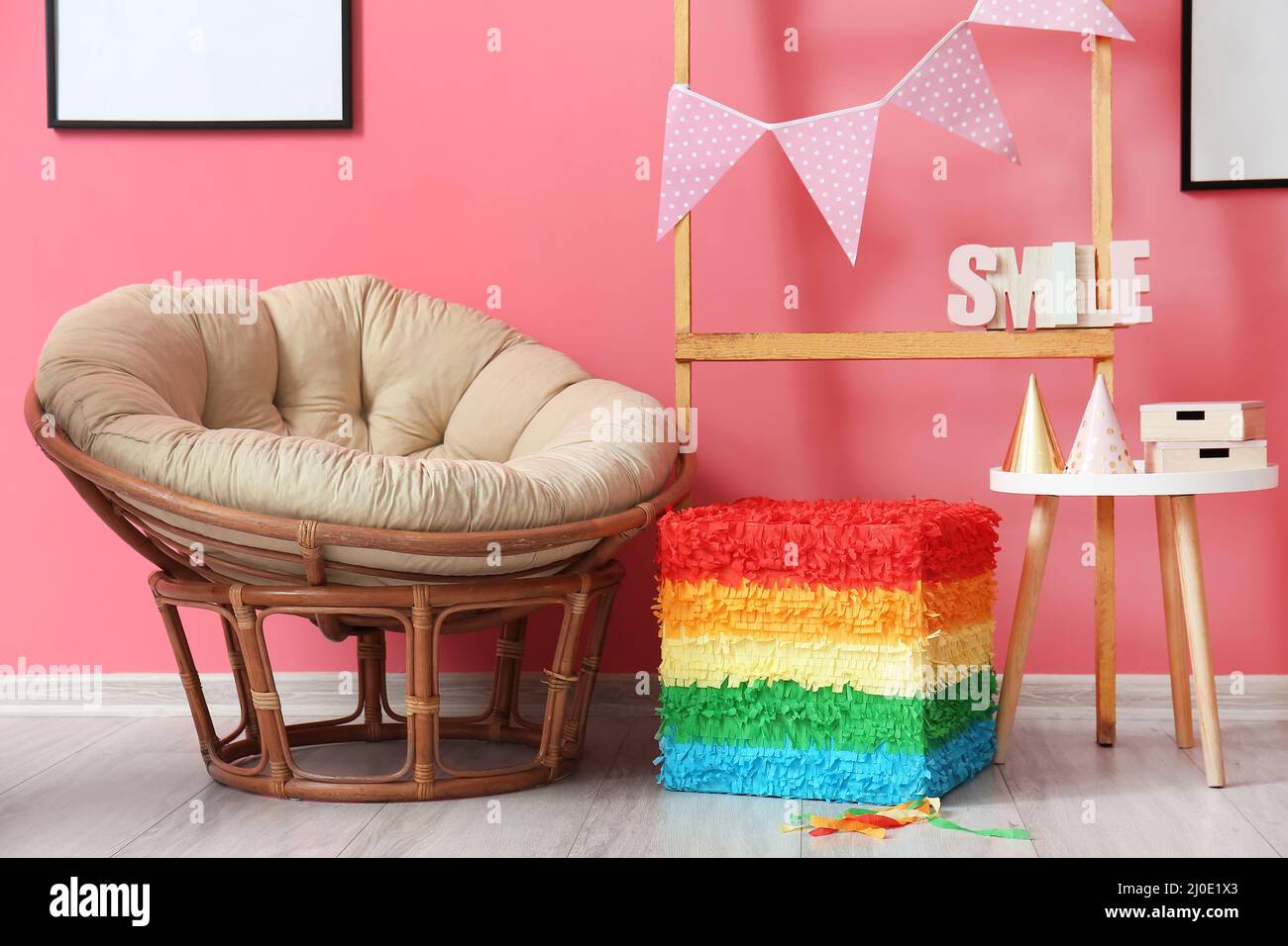 Interior of stylish room with Mexican pinata and armchair Stock Photo ...