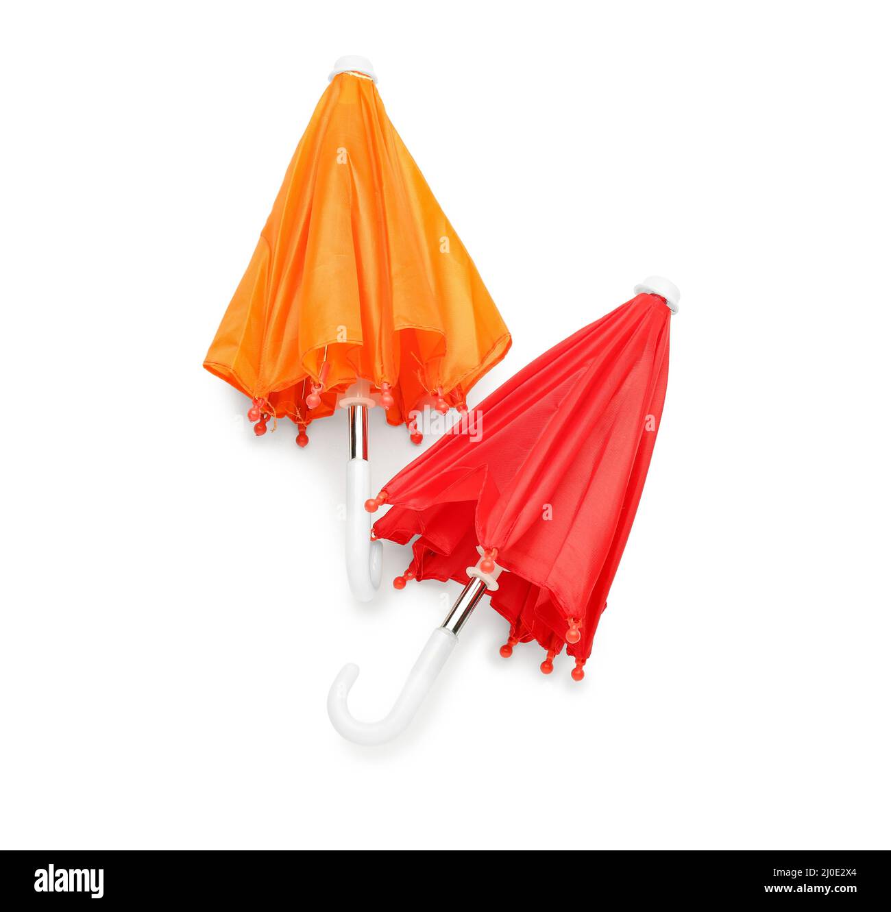 Two colorful umbrellas on white background Stock Photo - Alamy