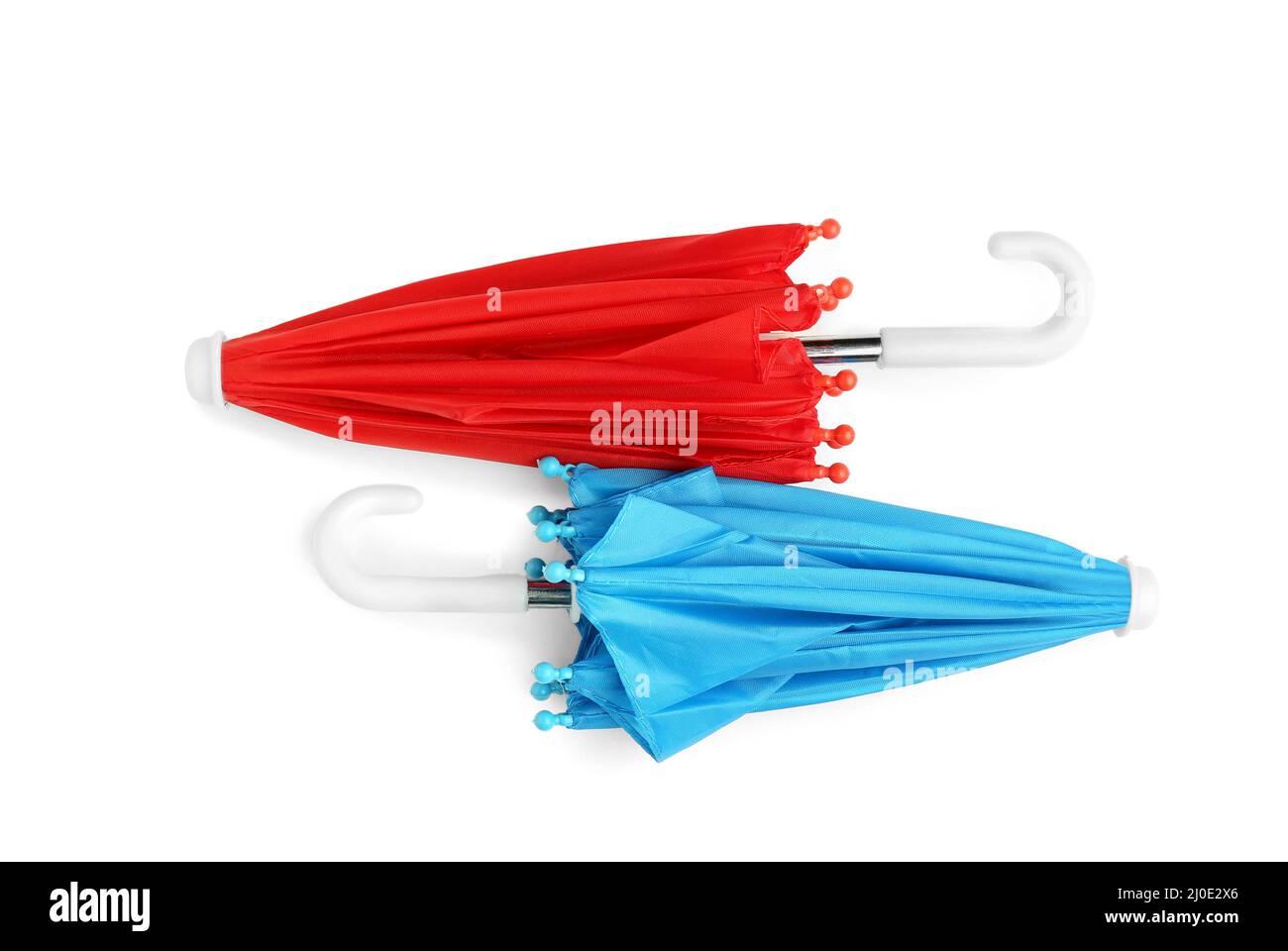 Two umbrellas on white background Stock Photo - Alamy