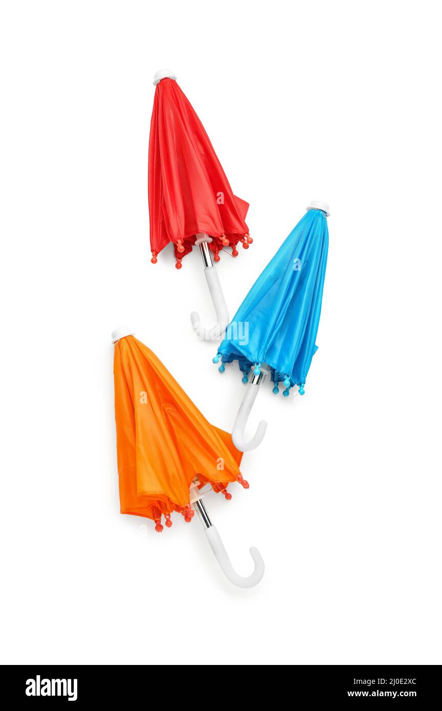 Different umbrellas on white background Stock Photo - Alamy