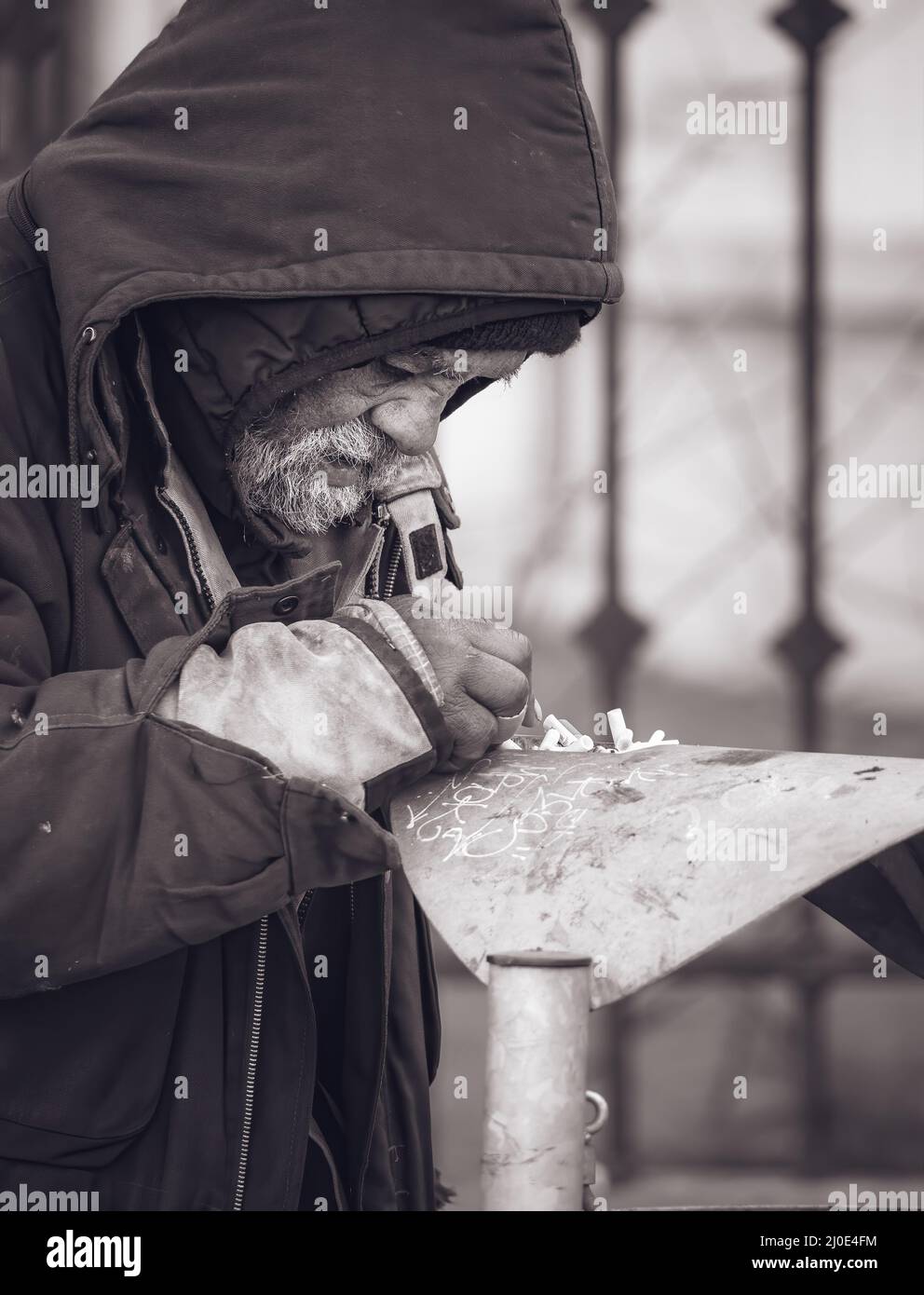 Bucharest, Romania - 02.04.2022: Homeless Man taking The Cigarette Butt ...