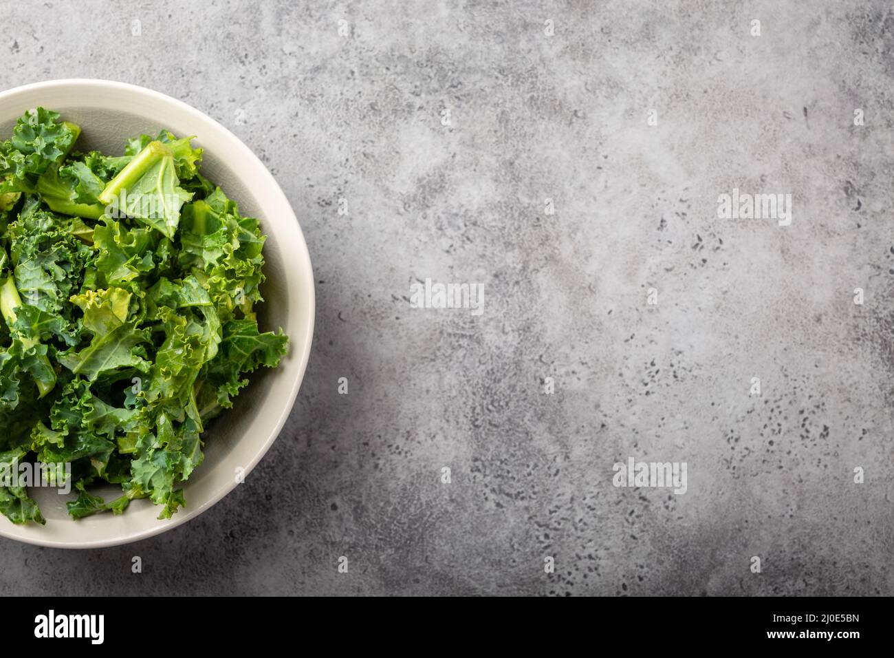 Bowl of fresh kale Stock Photo - Alamy