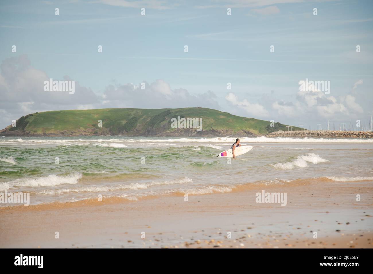 Coffs Harbour, NSW Australia - 17 March 2022: Woman coming in from a ...