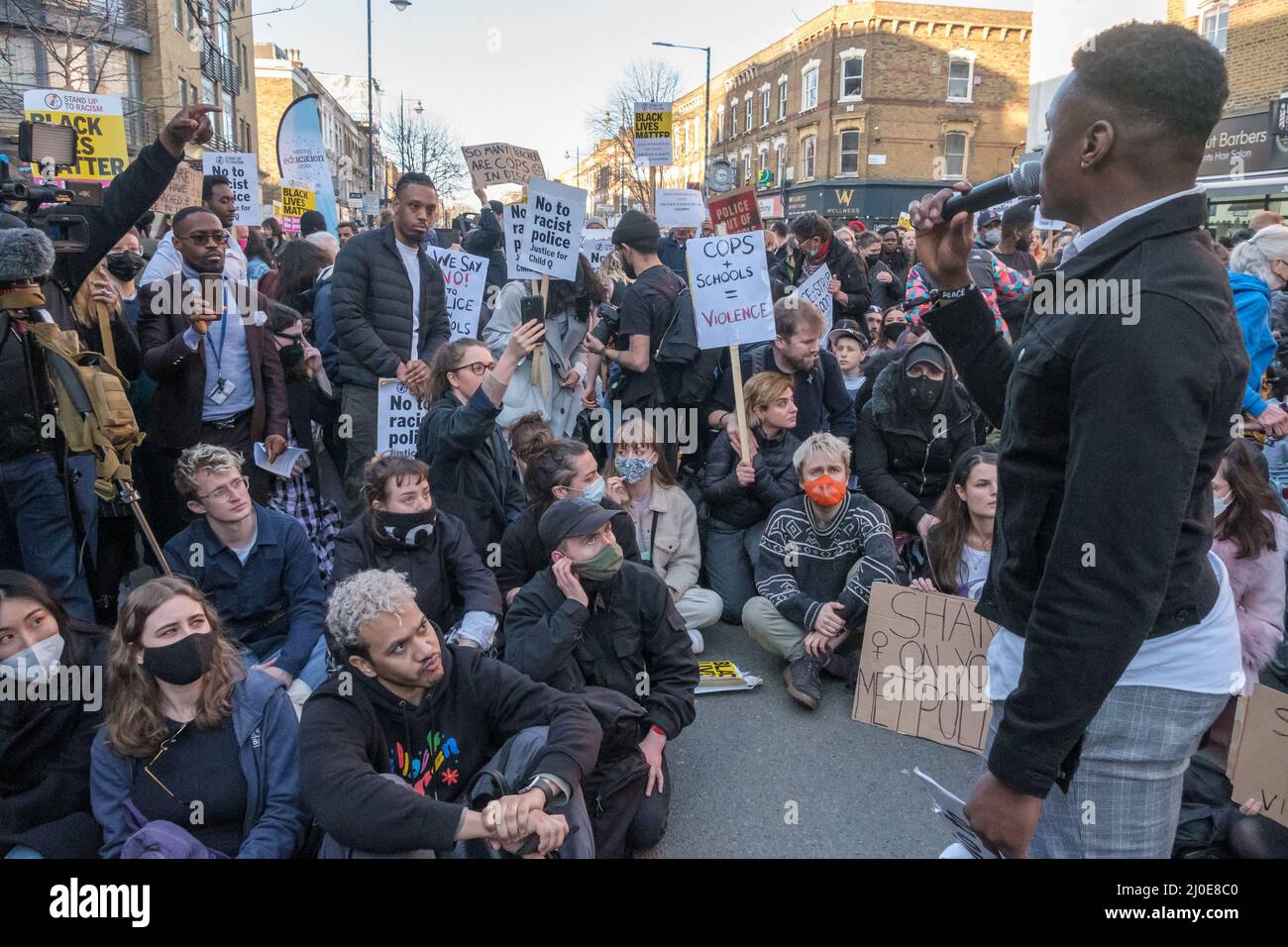 London, UK. 18th Mar 2022. Hackney Cop Watch protesters block the road ...