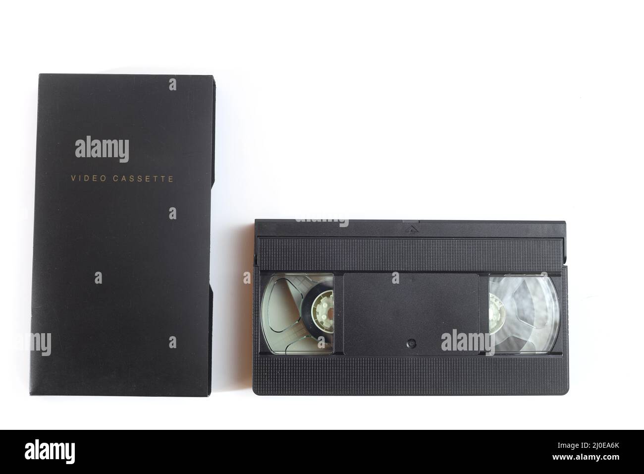 Black VHS video tape cassette with blank label isolated on white ...