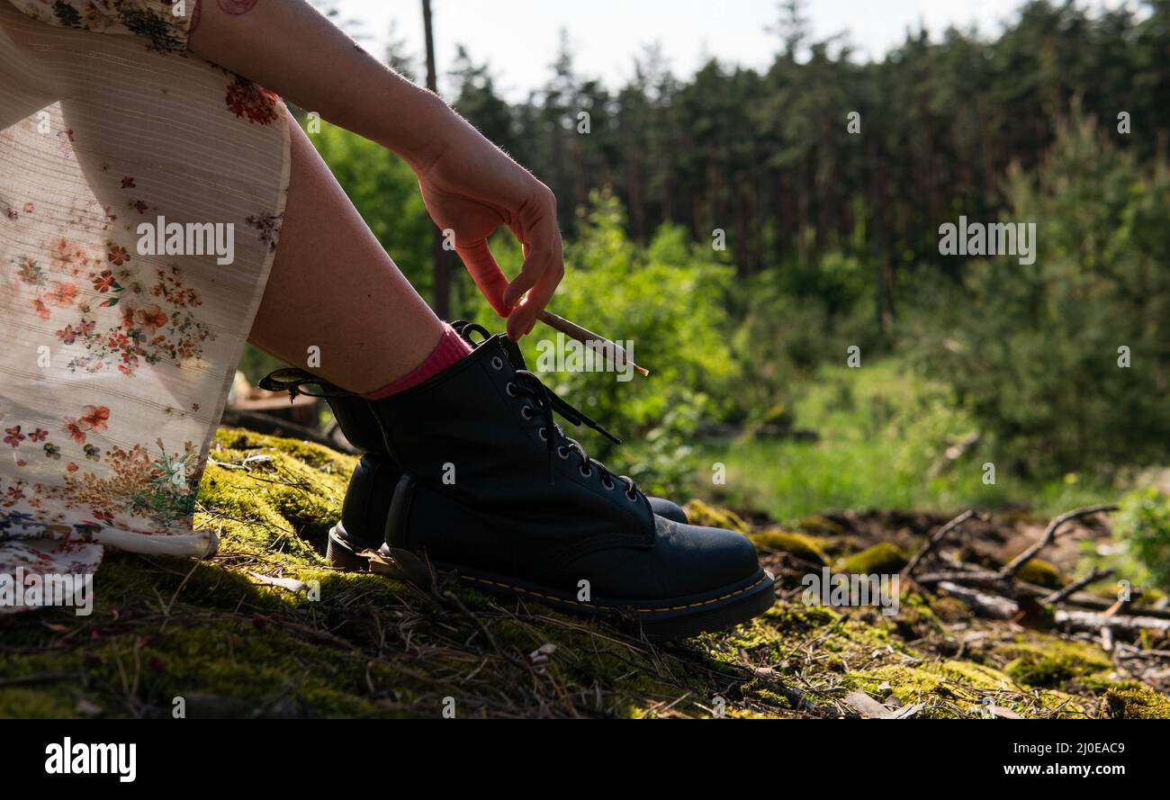 twisting joint with marijuana in nature. Recreational use of cannabis ...