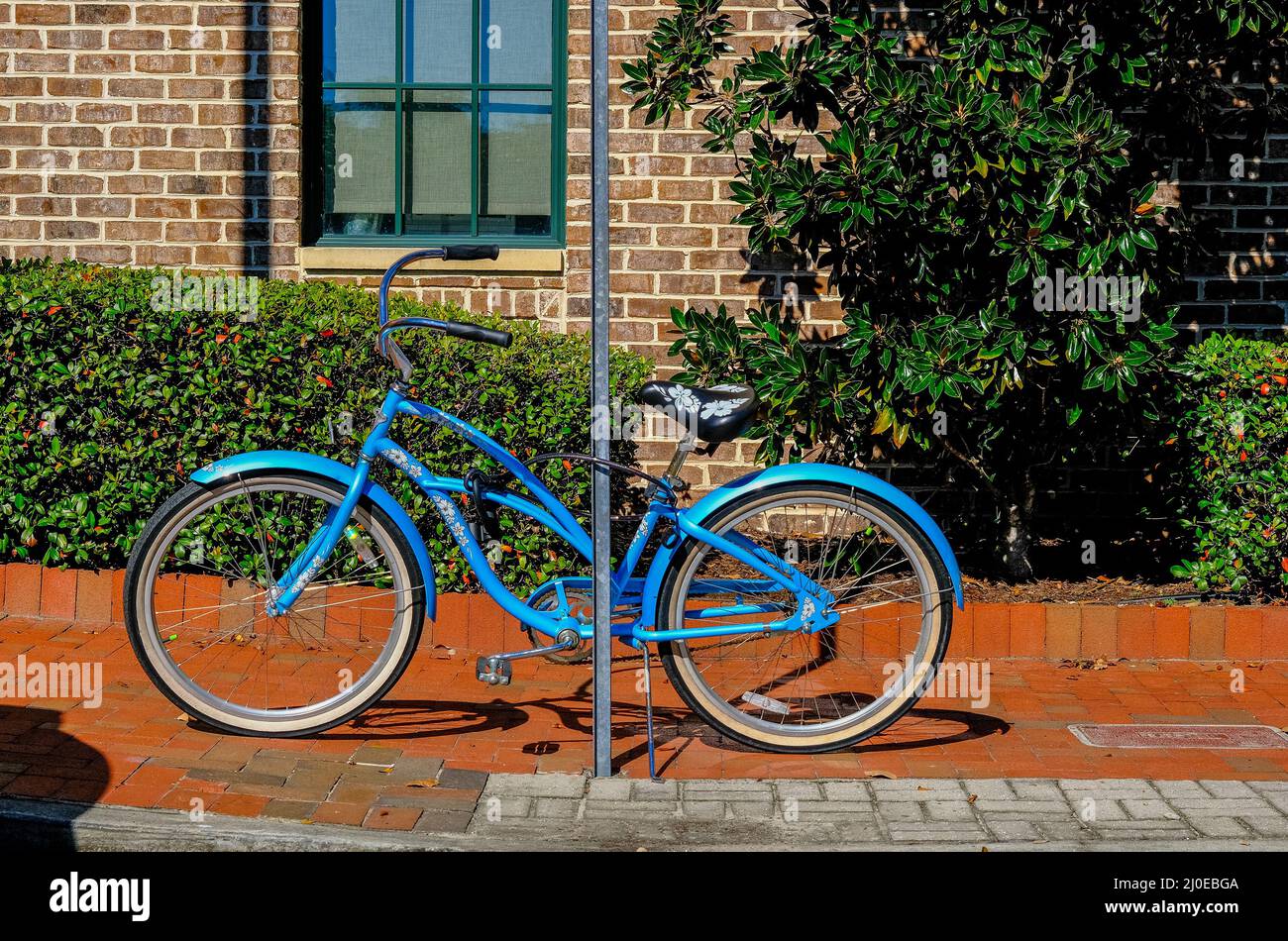 Blue Bike Chained to Sign Stock Photo - Alamy