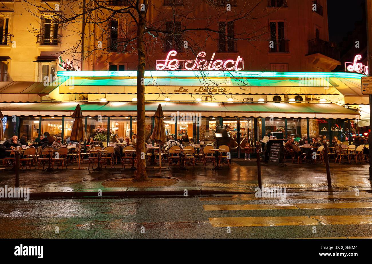 The famous cafe Le Select decorated at rainy night , Paris, France ...