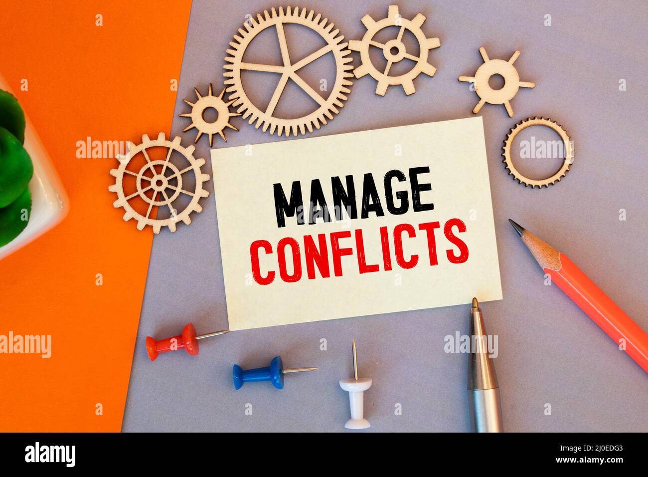 Business concept. Notebook with text MANAGE CONFLICTS sheet of white ...