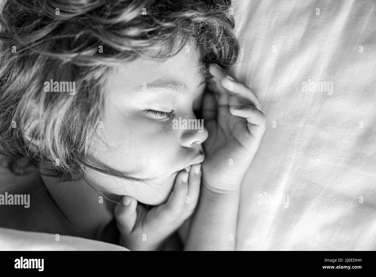 Concept of kids sleep. Child sleeping alone in comfortable bed with ...