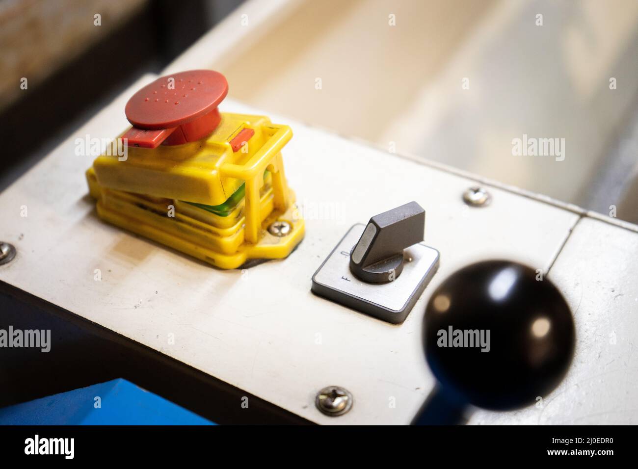 red ignition button of a milling machine Stock Photo - Alamy