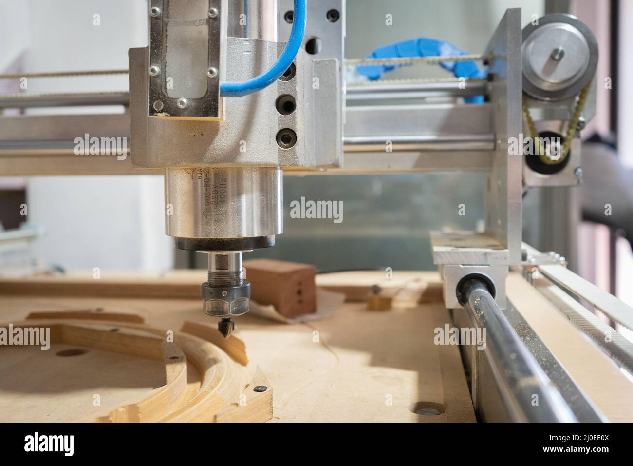 cnc router at work in the workshop making a wooden steering wheel for a ...