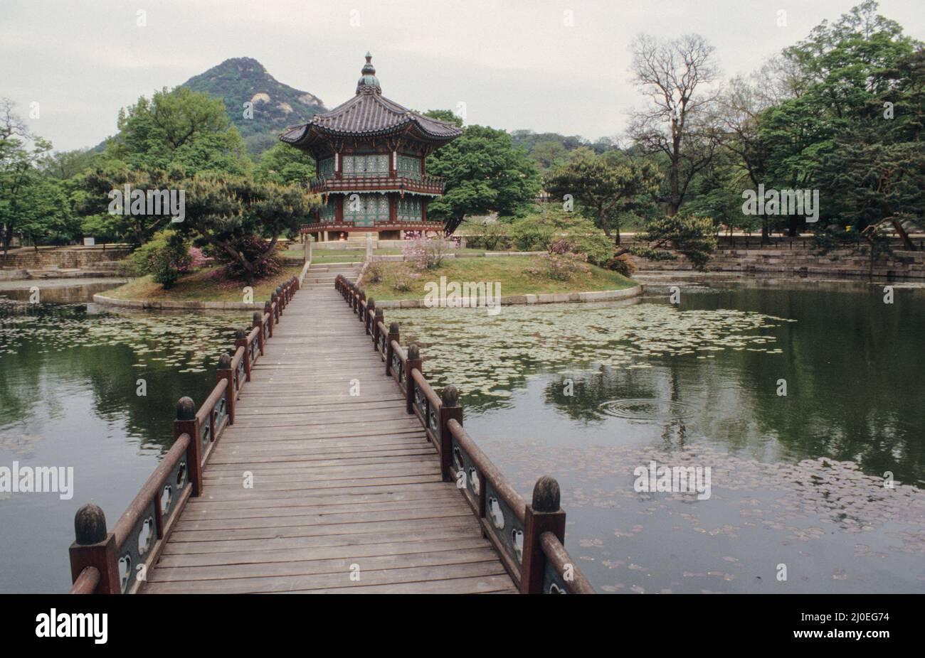 Pagoda in the middle of a pond at the great Gyeongbokgung palace of ...