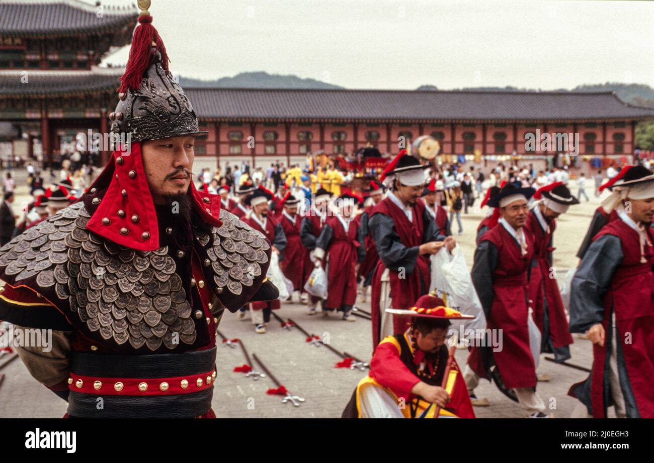 Actors dressed as guards and court officials prepare for their ...