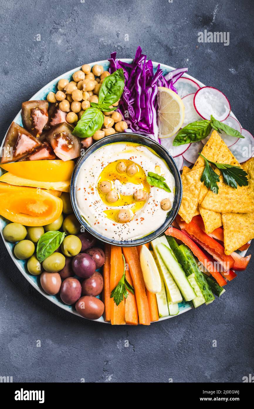 Hummus platter with assorted snacks Stock Photo - Alamy