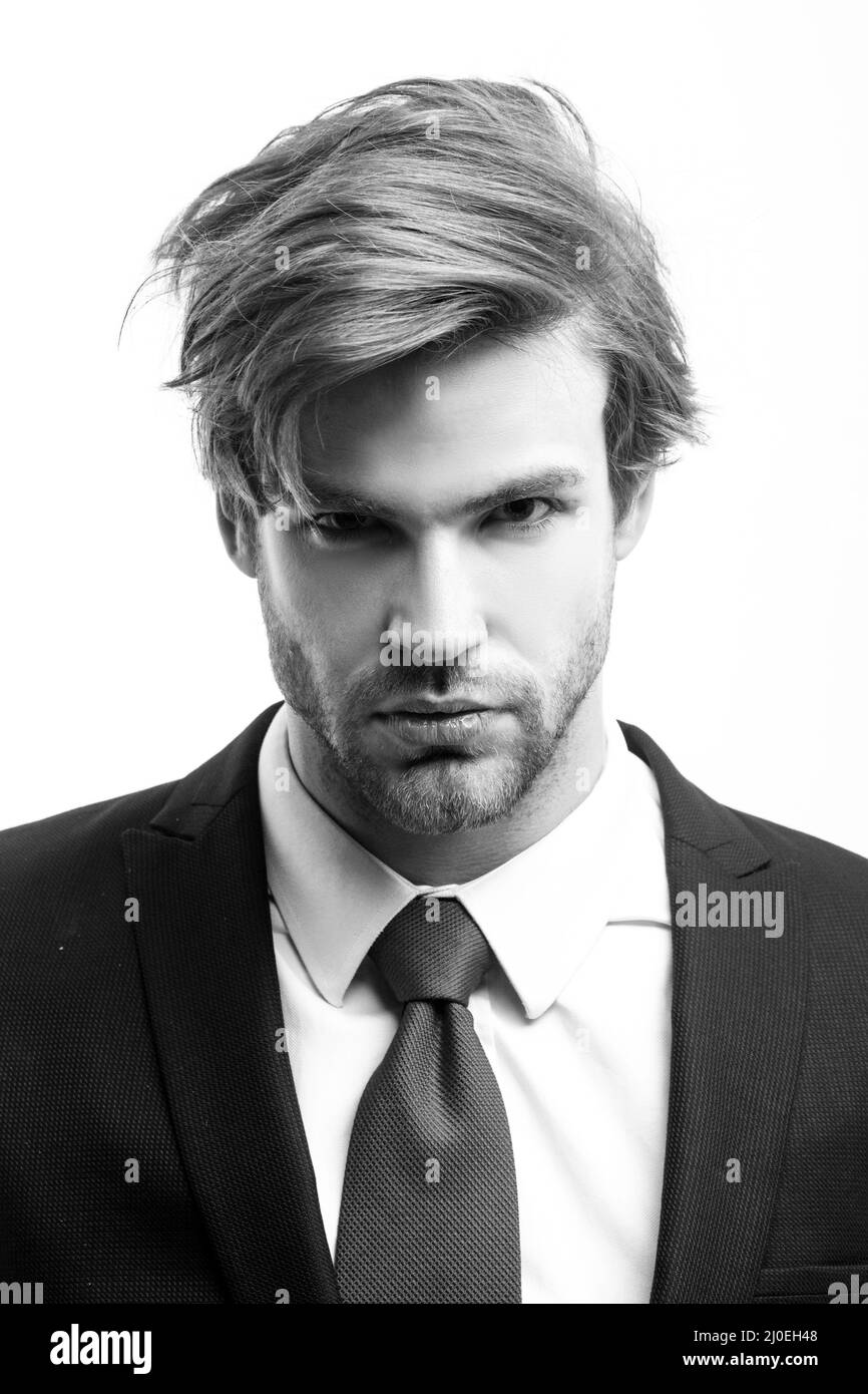 Portrait of serious young businessman, isolated on white background ...