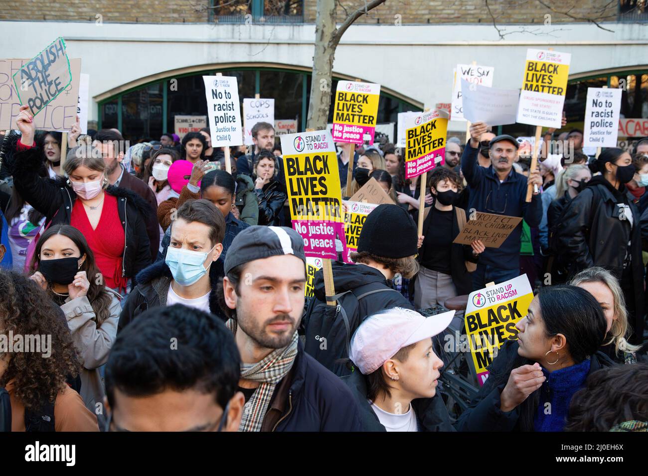 London, UK. 18th Mar, 2022. Protesters hold placards expressing their ...