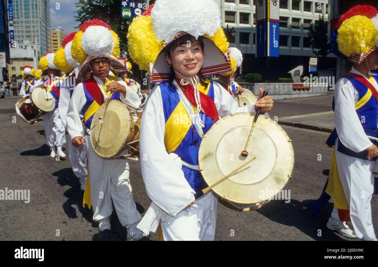 Members of a folklore-group parading with drums through Seoul on the ...