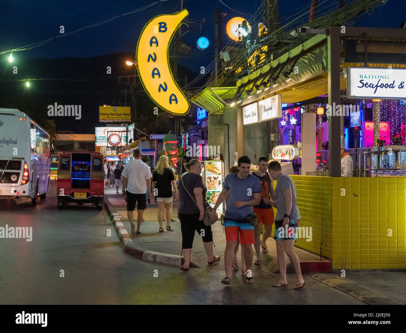 Thawewong Road in Patong by night. This road along Patong beach is very ...