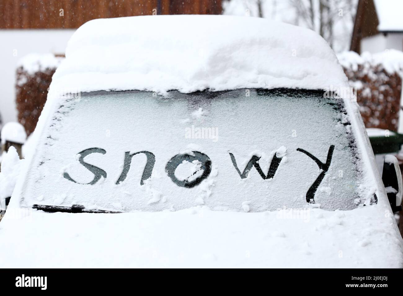 Snowy text on a windscreen Stock Photo - Alamy