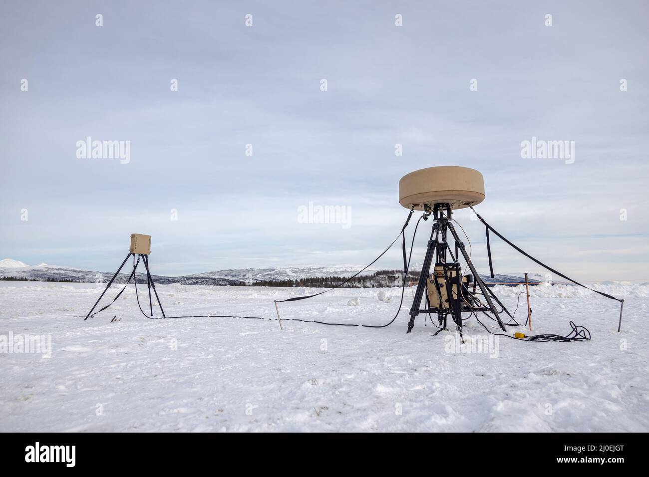 An AN/TRN-47 Tactical Air Navigation (TACAN) system is staged next to ...