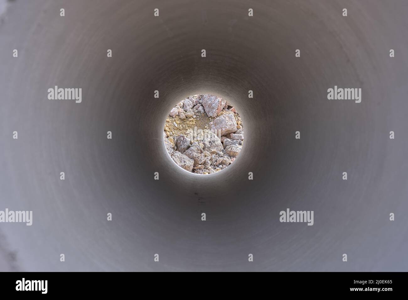 detail of the interior view of a concrete pipe for highway construction ...