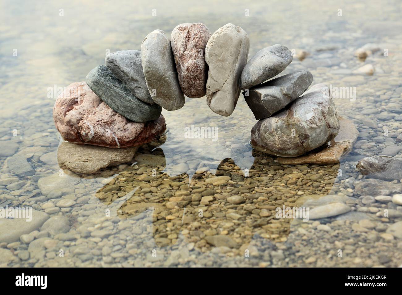 Stone bow in water Stock Photo - Alamy