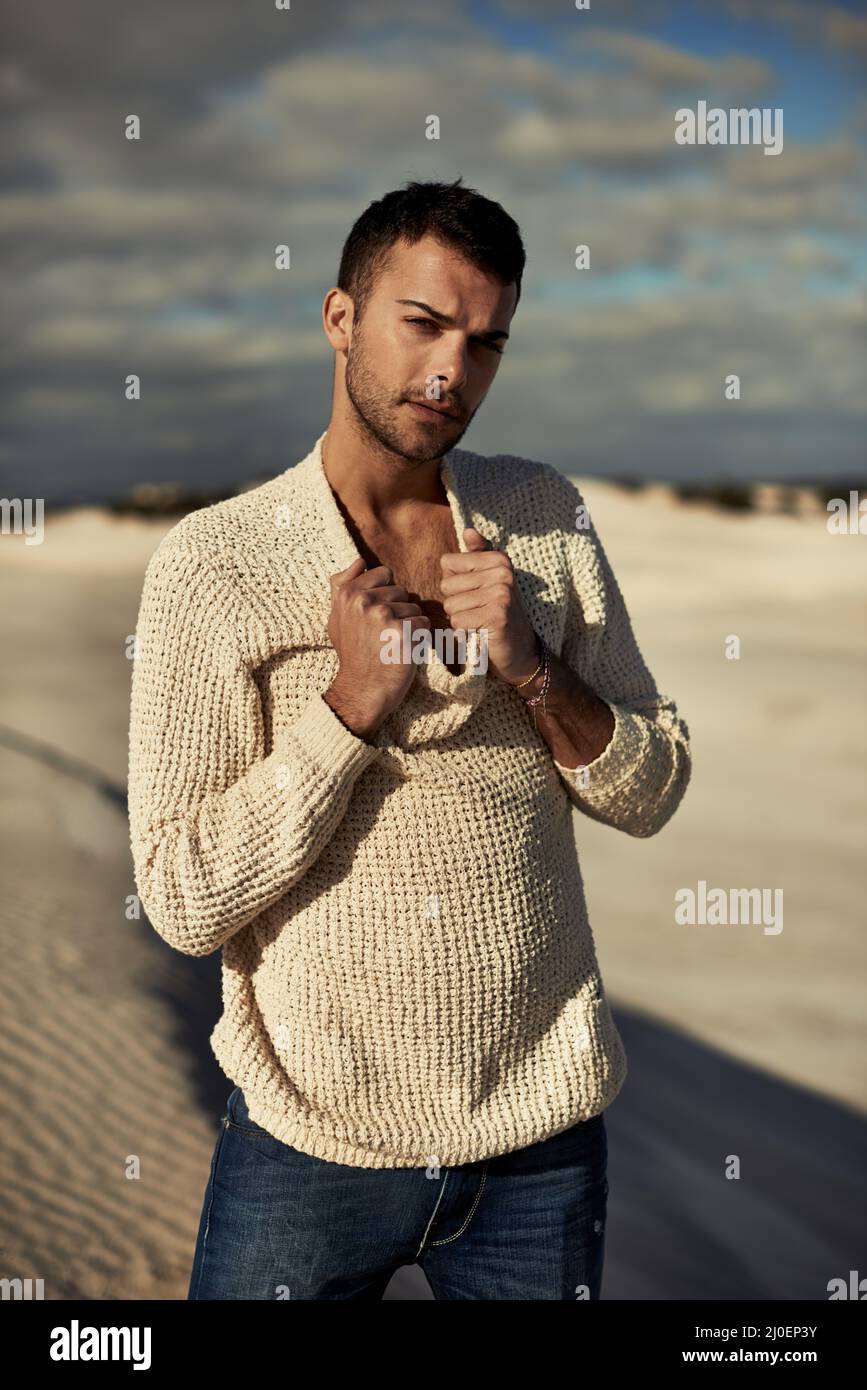 Getting away from it all. A ruggedly handsome young man enjoying the ...