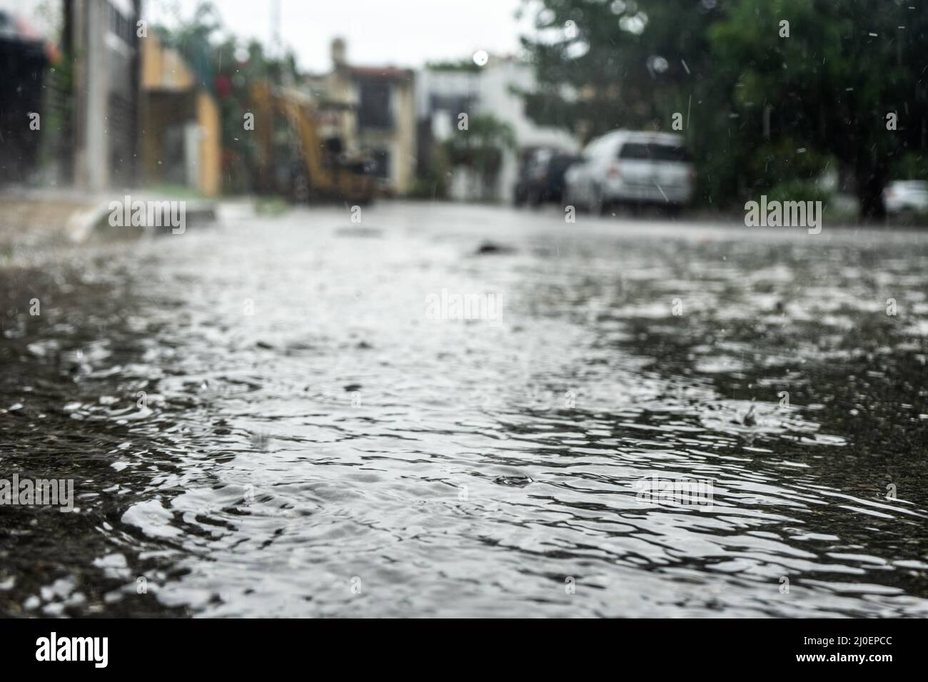 Raindrop falling on street hi-res stock photography and images - Alamy