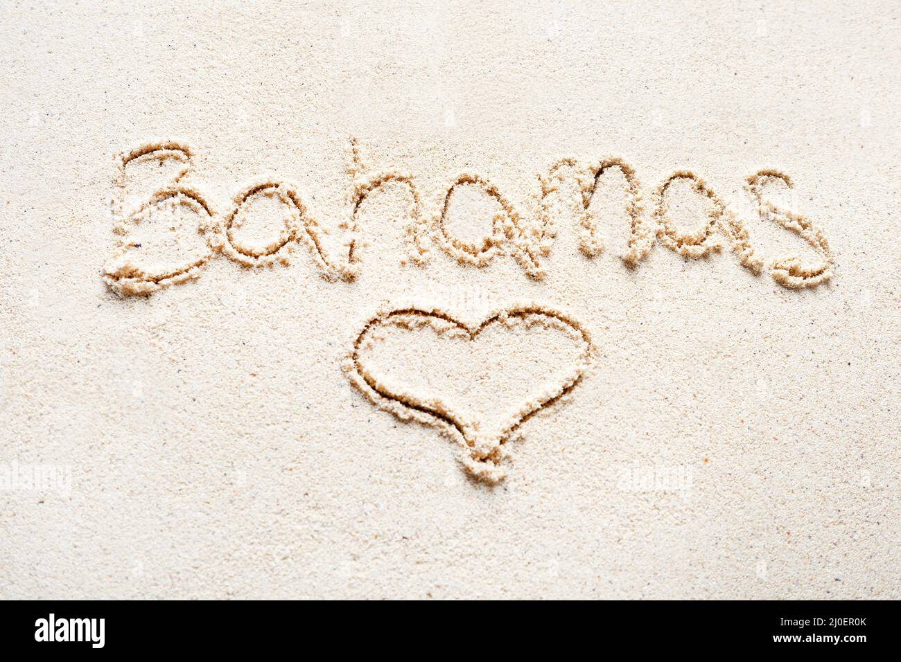 Handwriting words "Bahamas" on sand of beach Stock Photo - Alamy