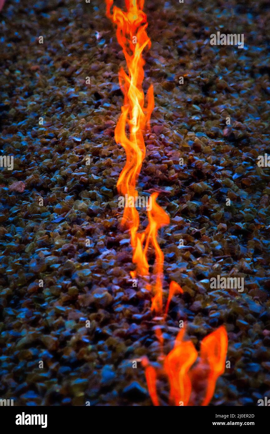 Flames burst from coals inside a Òfire-pitÓ at a California bar and ...