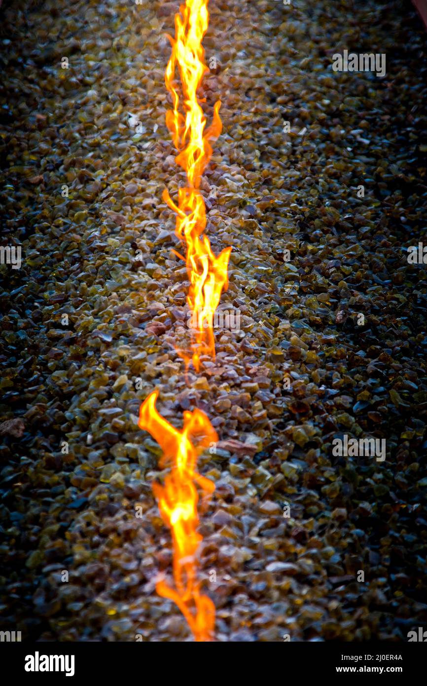 Flames burst from coals inside a Òfire-pitÓ at a California bar and ...