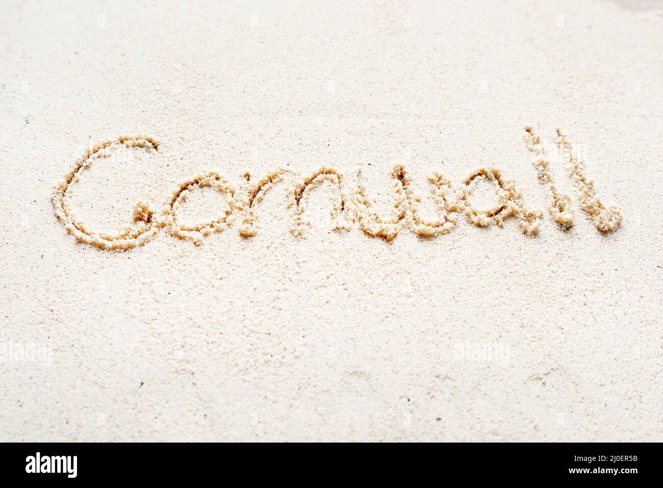 Handwriting words "Cornwall" on sand of beach Stock Photo - Alamy