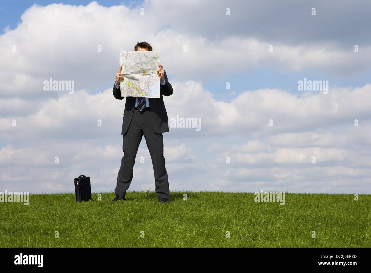 Business man reading map hi-res stock photography and images - Alamy
