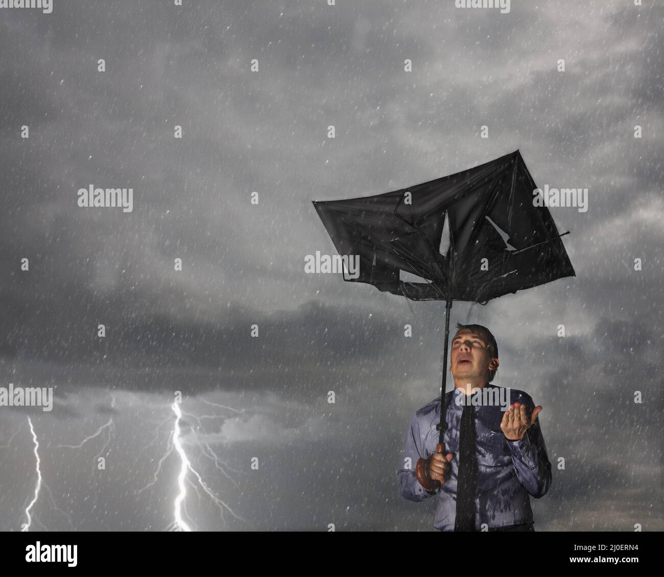 Businessman storm broken umbrella hi-res stock photography and images ...