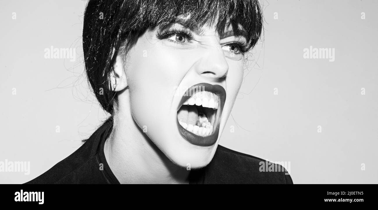 Woman shouting and screaming loud with open mouth. Human emotions ...