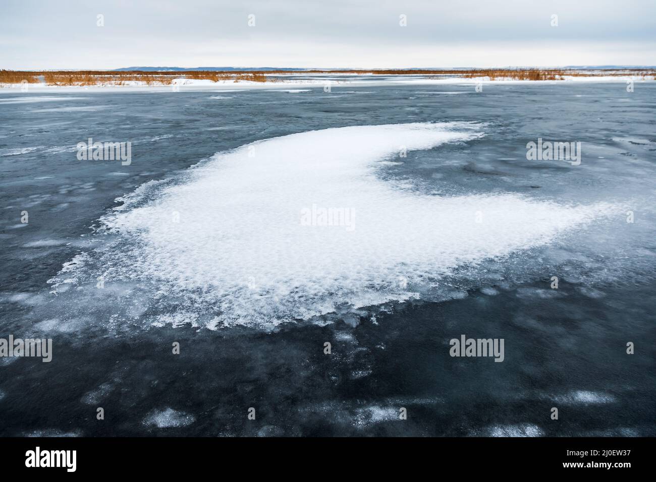 Ice crust on the river Stock Photo - Alamy