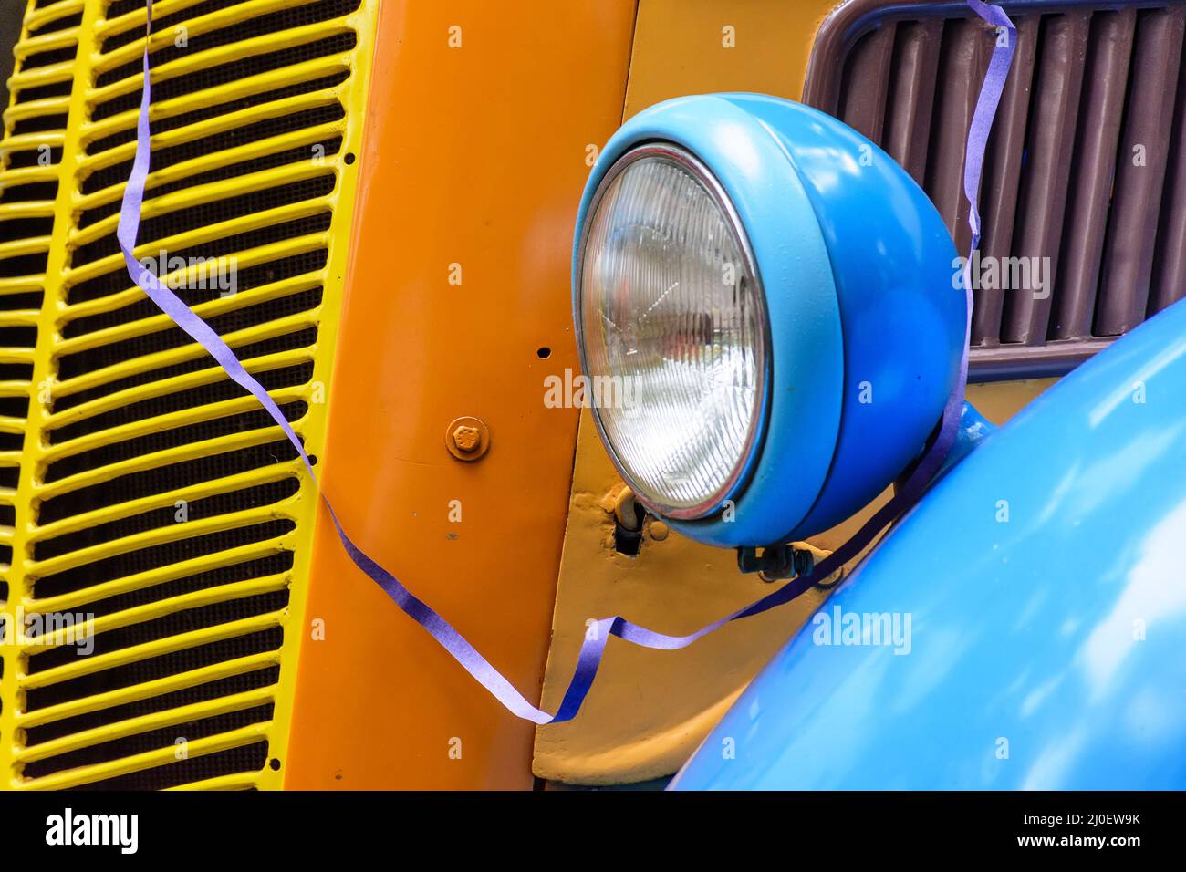 Front detail of old colorful and stylized car Stock Photo - Alamy