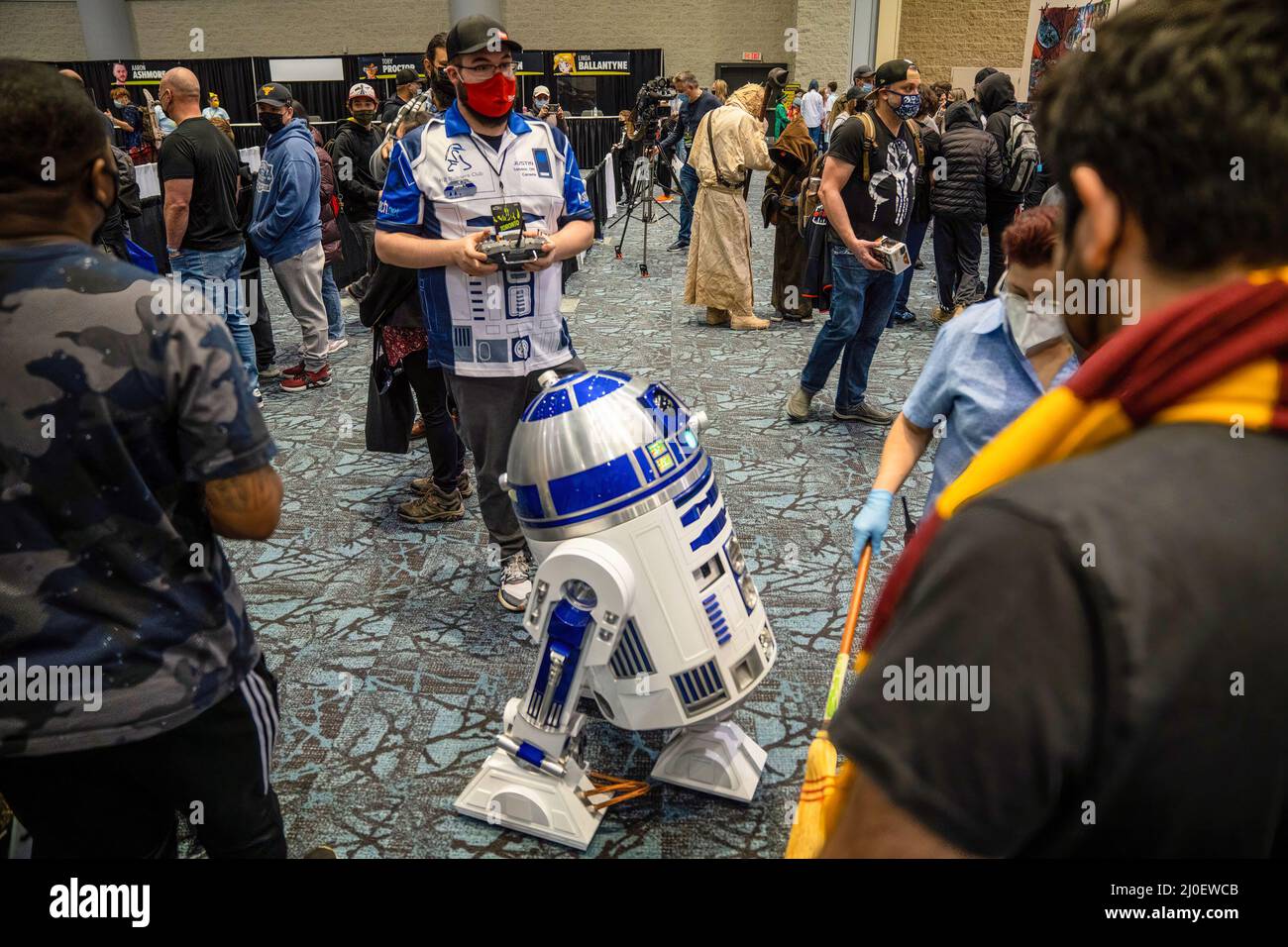 Toronto, Canada. 18th Mar, 2022. A man controls an animatronic R2D2 ...
