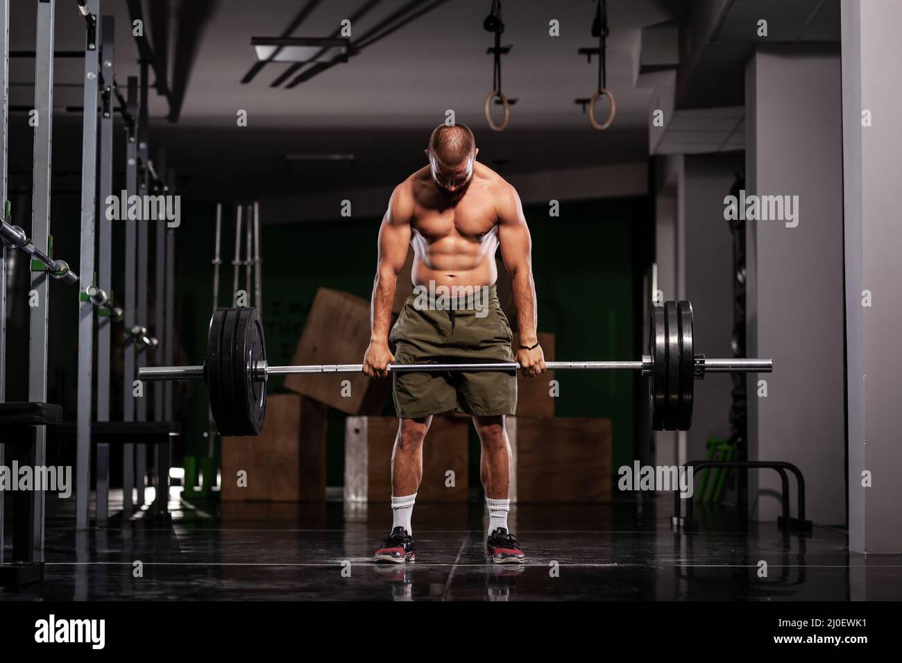 Muscular athlete lifting very heavy barbell Stock Photo - Alamy