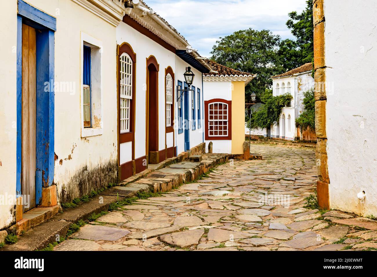 Street in colonial architecture with stone paving in Tiradentes city ...