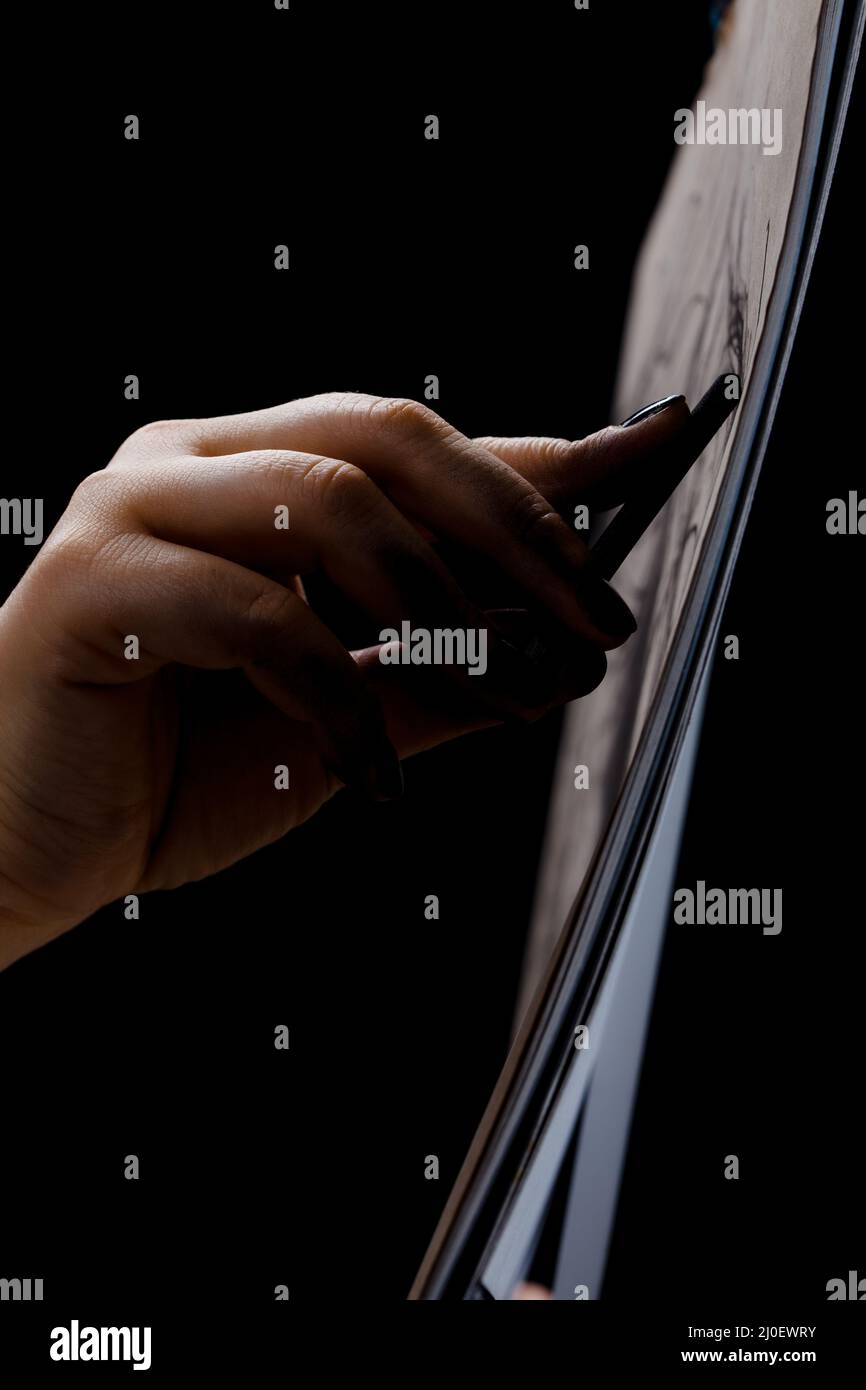 Artist drawing with chalk. Abstract hand painting on paper against ...