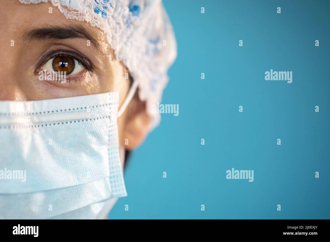Close up young doctor wearing blue surgical cap hi-res stock ...
