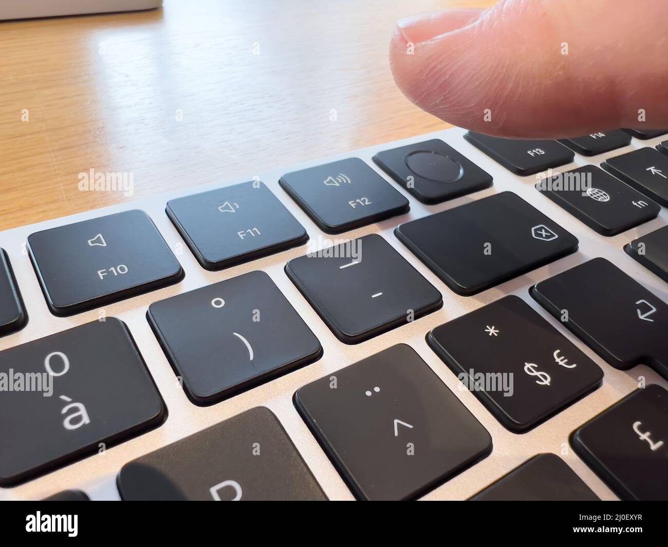 Paris, France - Mar 18, 2022: Macro shot male hand pressing fingerprint ...